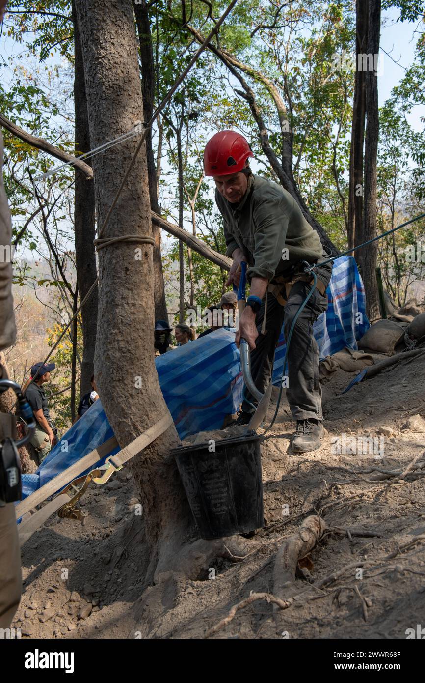 Robert Godec, U.S. Ambassador to the Kingdom of Thailand, places soil ...