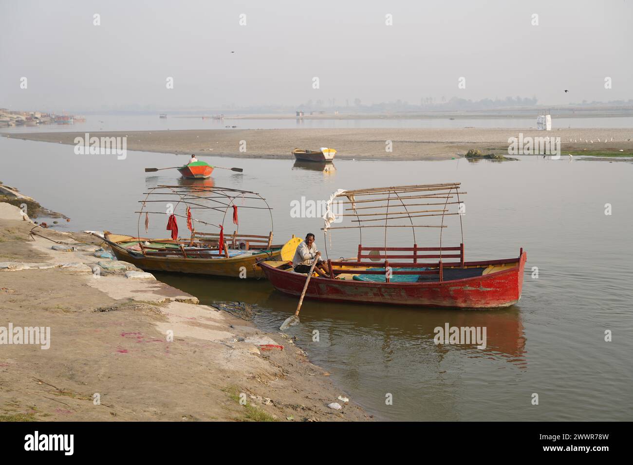 The Ganges with floating boats near Guptar Ghat or Narayan Ghat. Civil Lines, Kanpur, Uttar ...