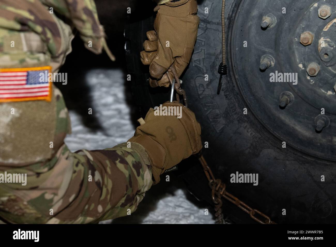 Snow chains secured to a High Mobility Multipurpose Wheeled Vehicle ...