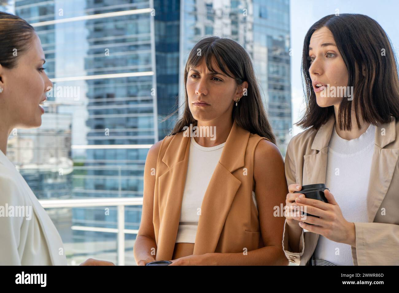 The female boss is informing her two employees that the break has ...