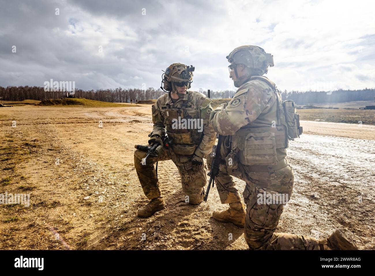 U.S. Army 1st lt. Jeffrey Workman, left, attached to 3rd squadron, 2nd ...