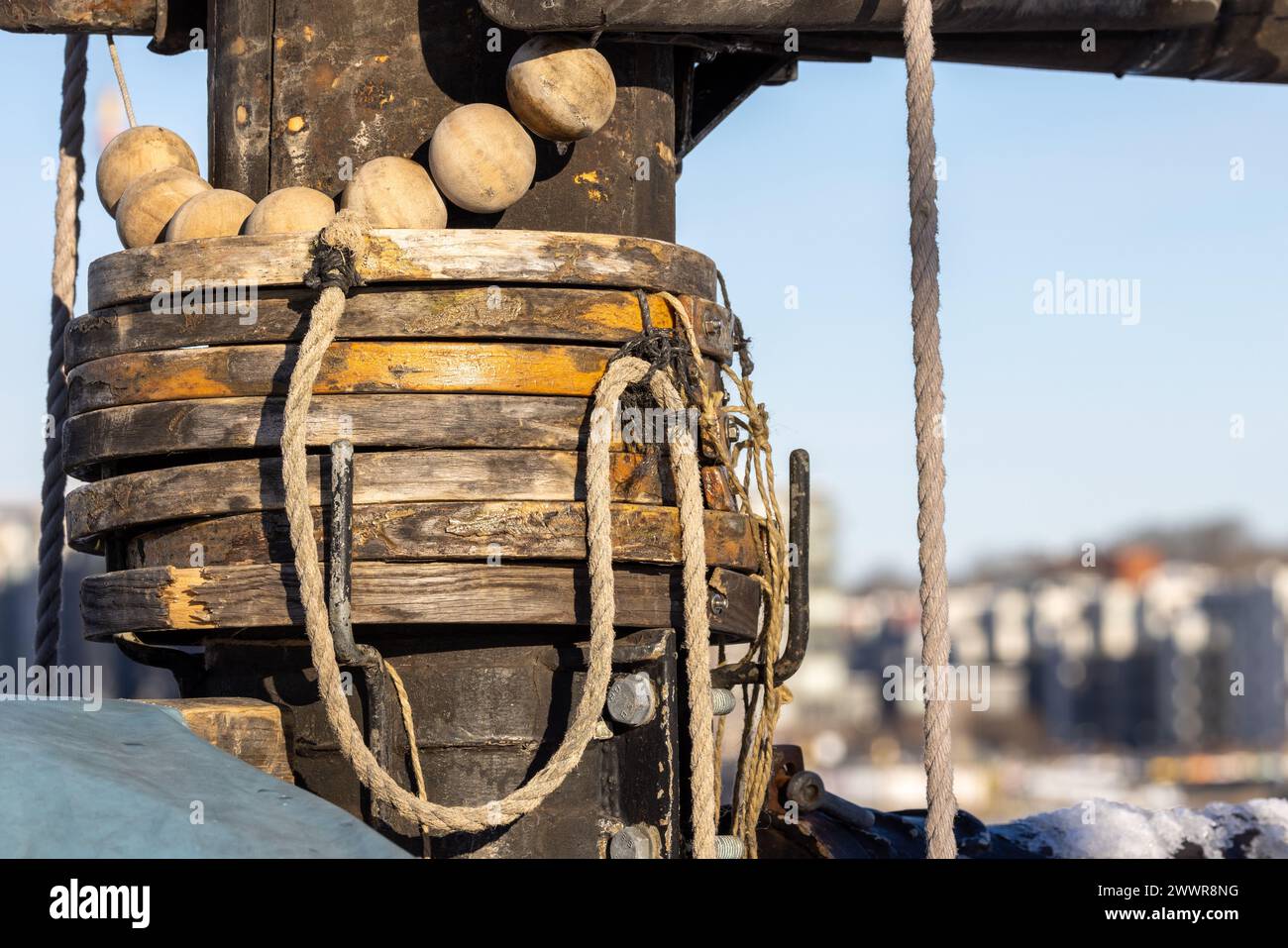 Mast rope and rings on old sailing boat. Blue sky background Stock ...