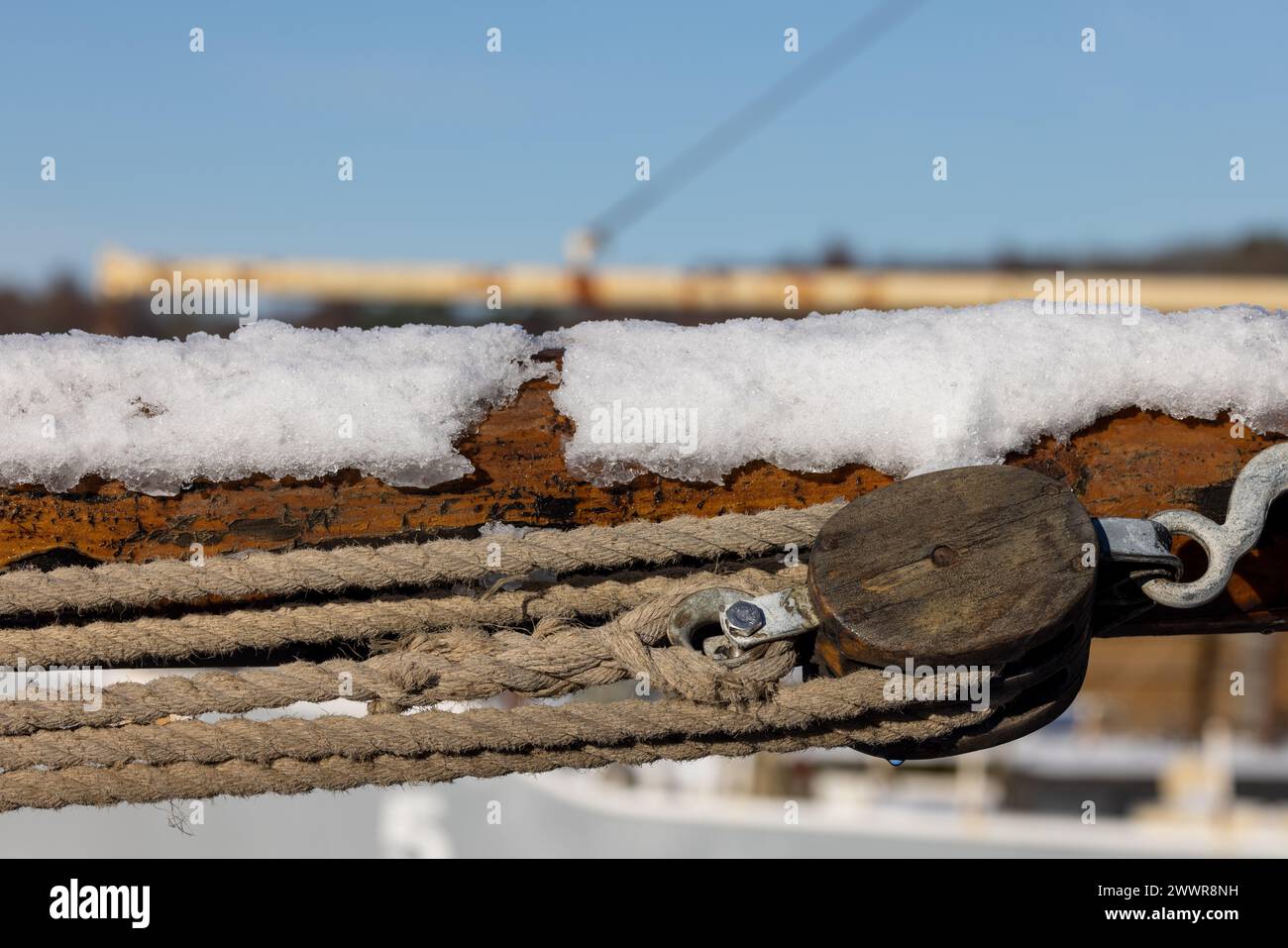 Mast rope and pulley on old sailing boat. Blue sky background Stock ...