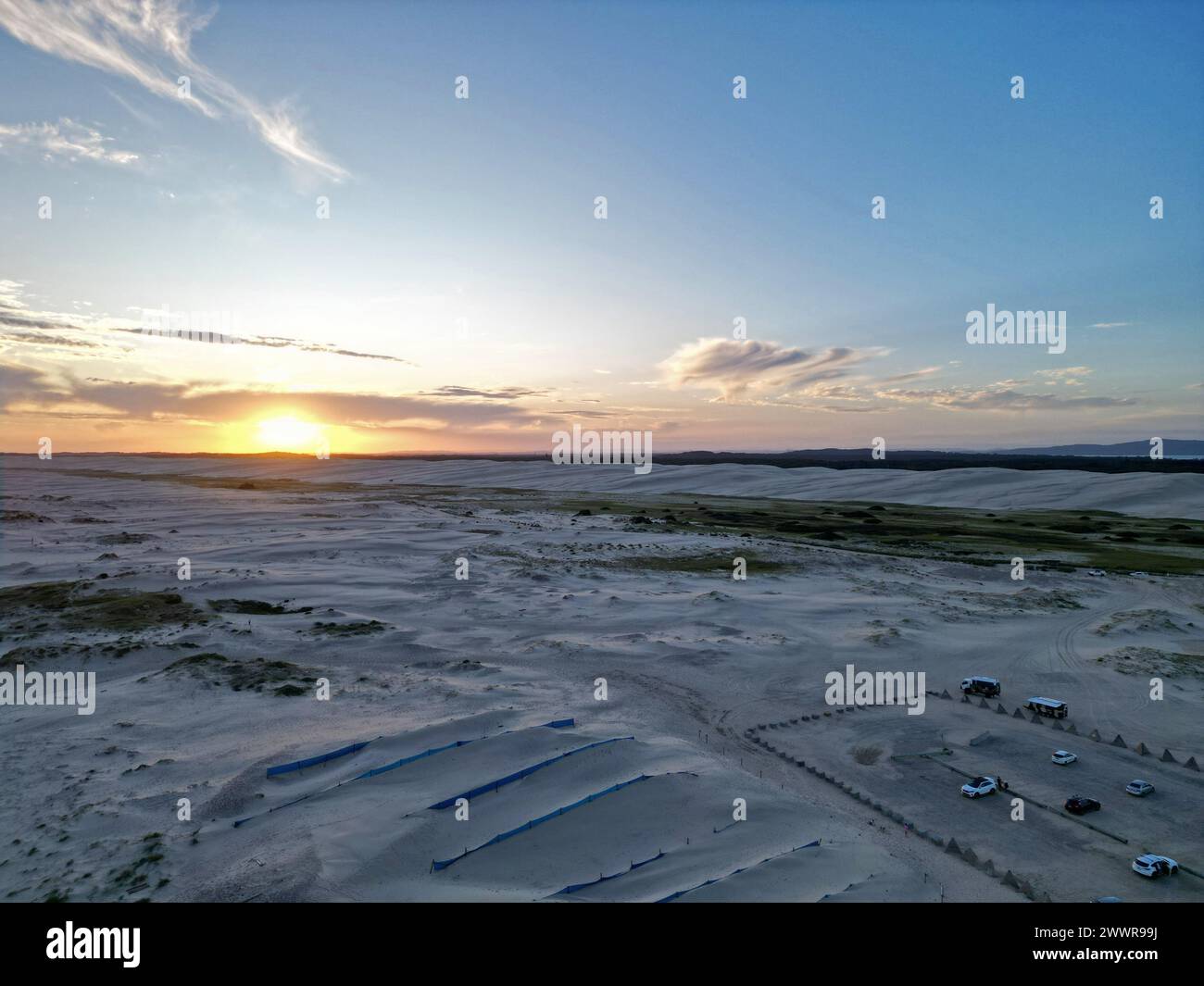 An aerial view of a sunset at Stockton Beach, Anna Bay, Port Stephens ...