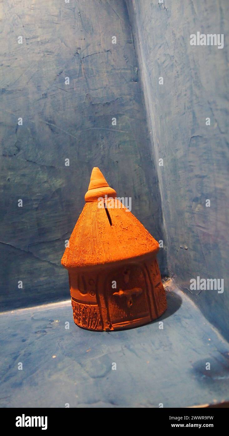 Clay money box Stock Photo - Alamy