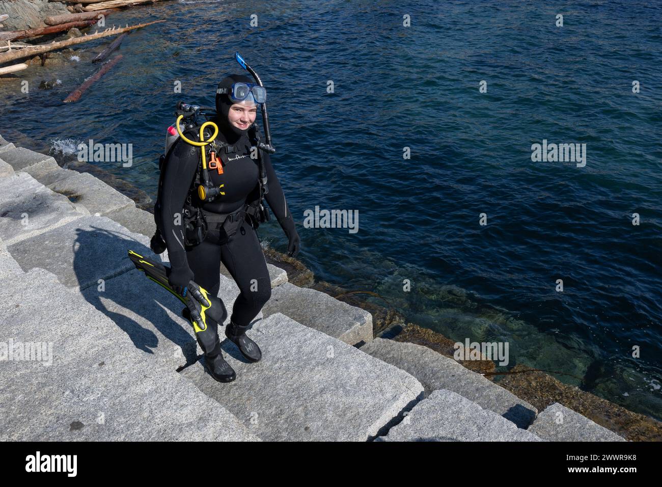Female diver on the dock at Ogden Point that is a deep water port ...