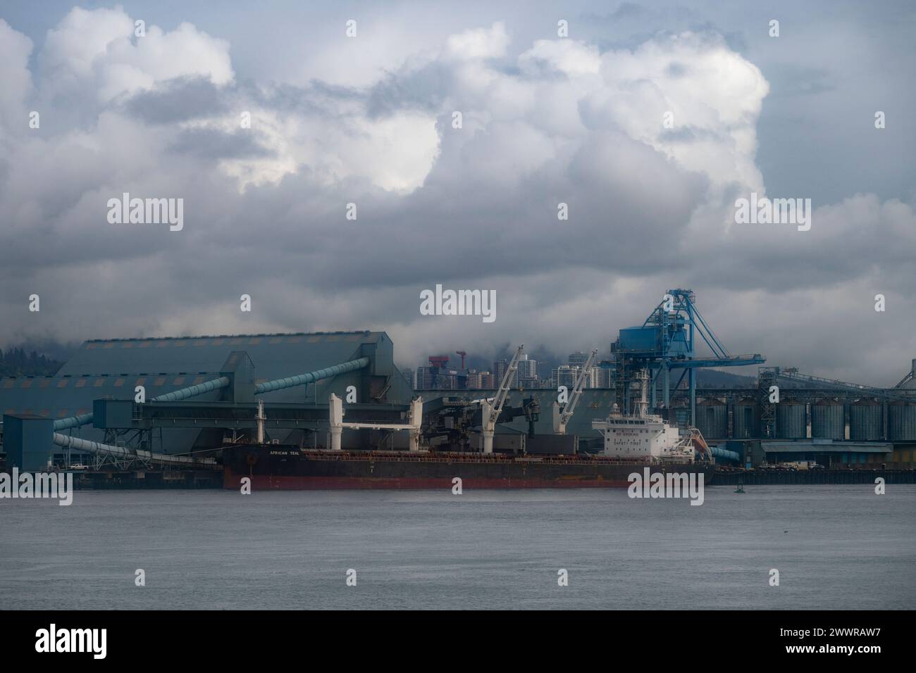 Cargo ship at the Port of Vancouver loading docks in Burrard inlet ...