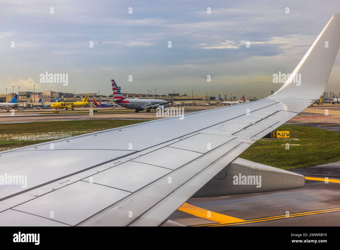 View from the airplane window as the aircraft awaits its turn for ...