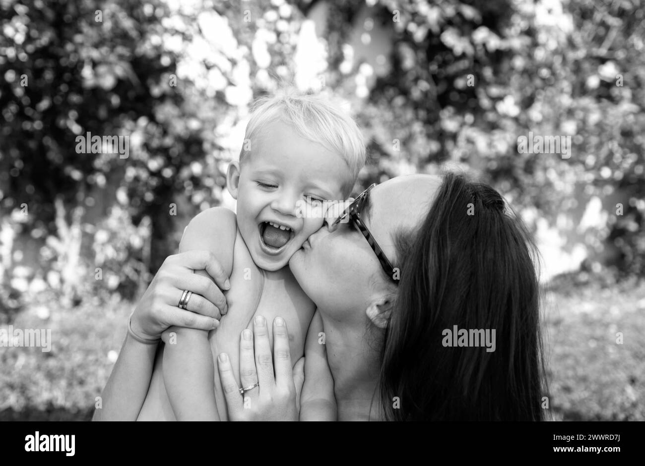 Happy child son hug mom. Family mother and boy smiling and hugging ...