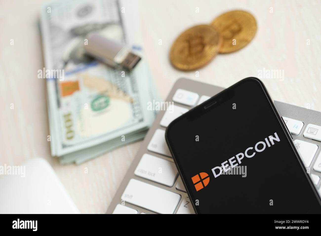 KYIV, UKRAINE - MARCH 15, 2024 Deepcoin logo on iPhone display screen ...