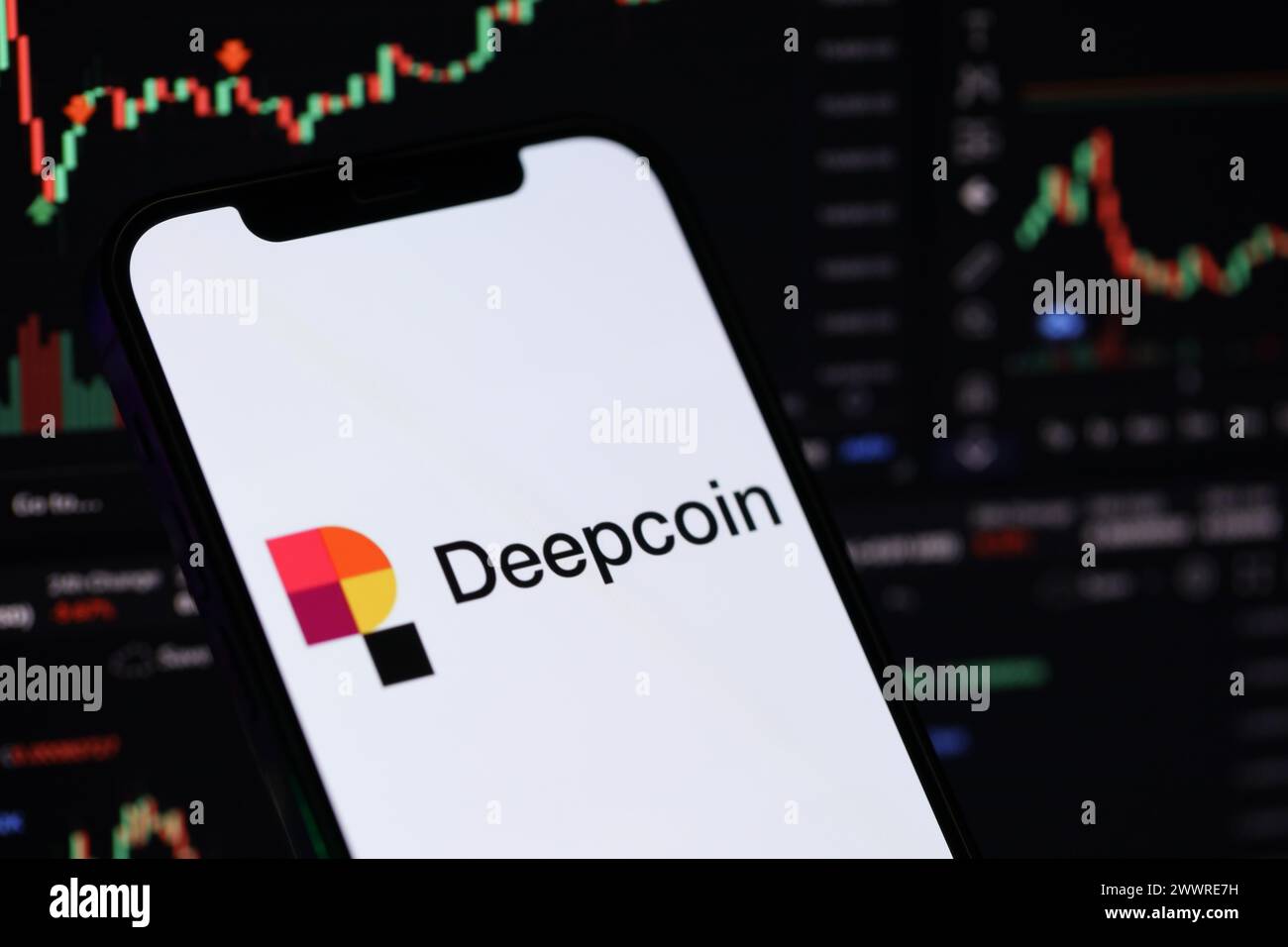 KYIV, UKRAINE - MARCH 15, 2024 Deepcoin logo on iPhone display screen and crypto currency value ...