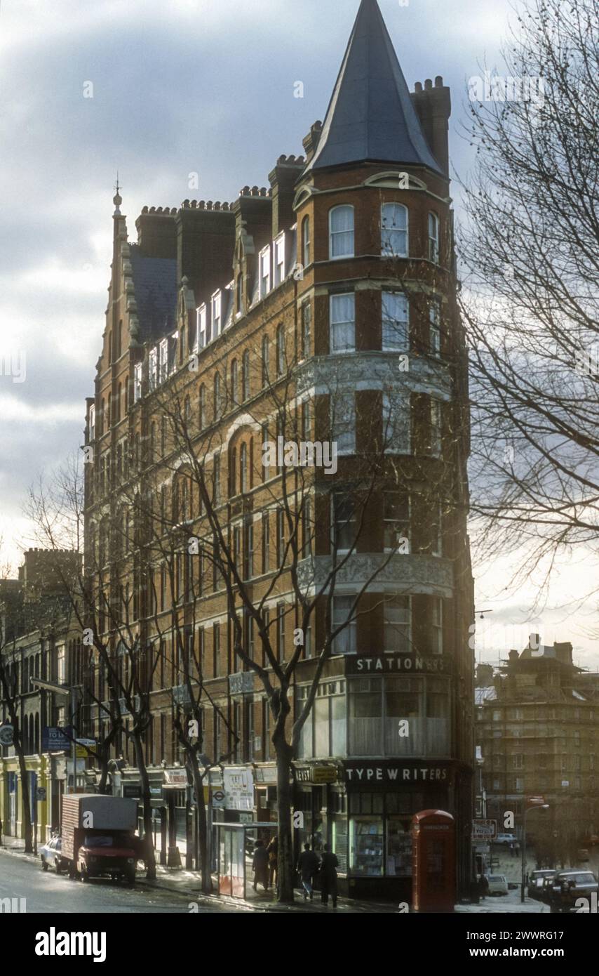 1983 archive photograph of flat-iron style building on corner of A401 ...