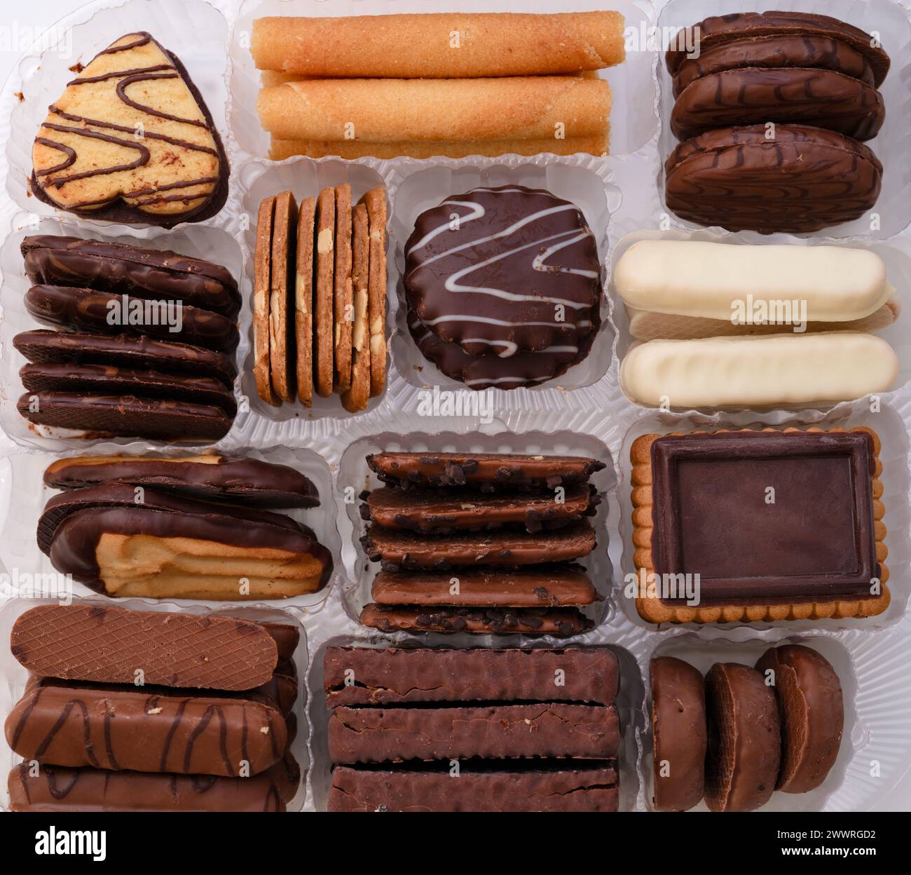 Different kinds of cookies sorting in box Stock Photo - Alamy