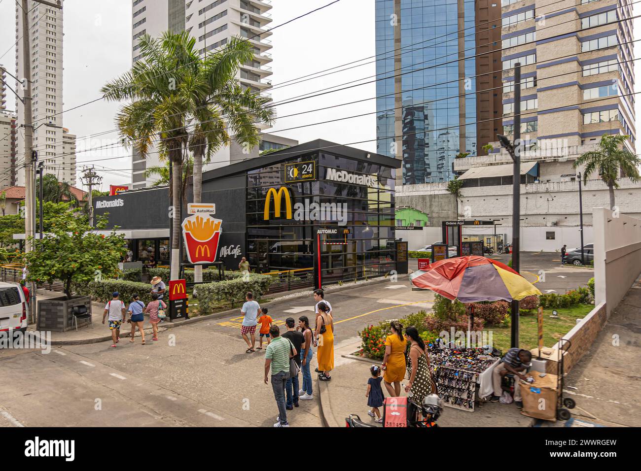 Cartagena, Colombia - July 25, 2023: Central Bocagrande Carrera 2. People walk business street ...