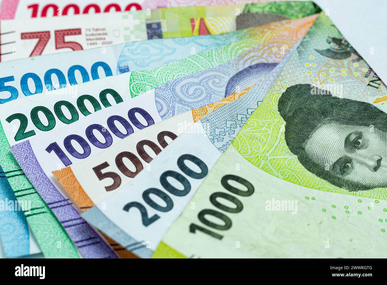 Indonesian currency. Stack of Rupiah or IDR banknotes inside white ...