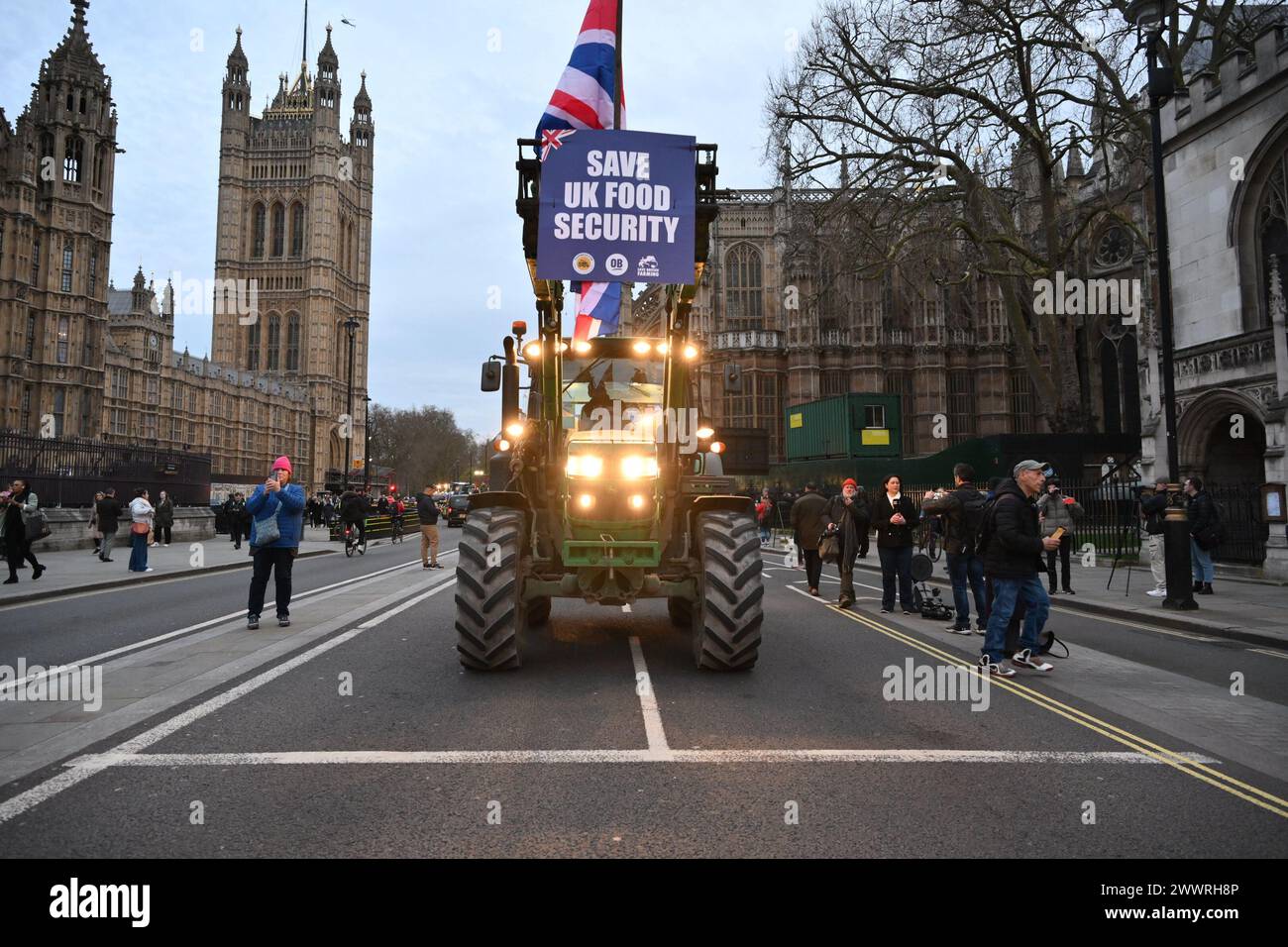 London, England, UK. 25th Mar, 2024. Farmers bring their tractors into ...