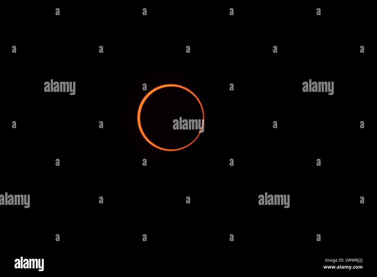 Photograph taken with a solar filter of a solar eclipse in which fire ...