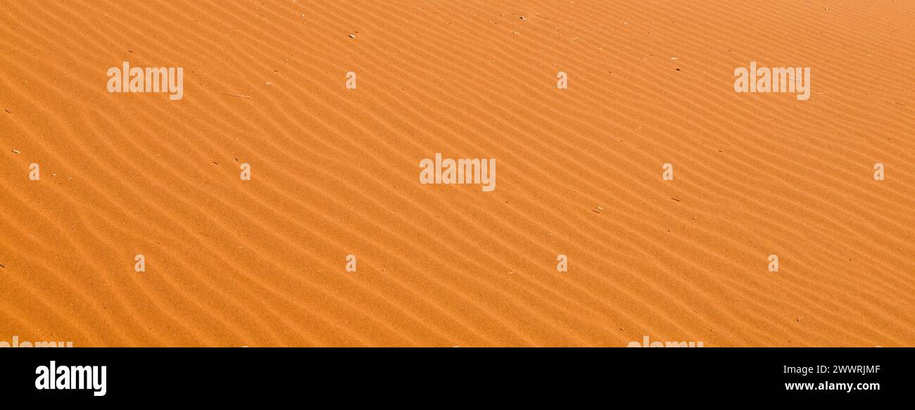 Orange desert sand texture formed by wind Stock Photo - Alamy