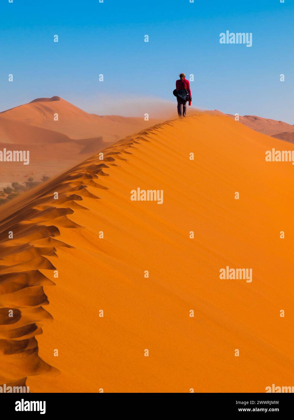 Female hiking hill windy hi-res stock photography and images - Alamy