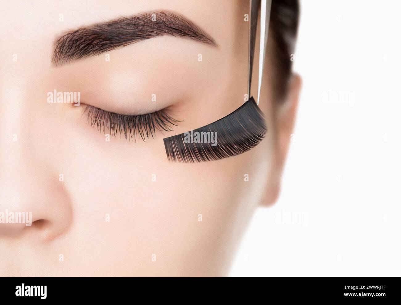 Eyelash removal procedure close up. Beautiful Woman with long lashes in ...