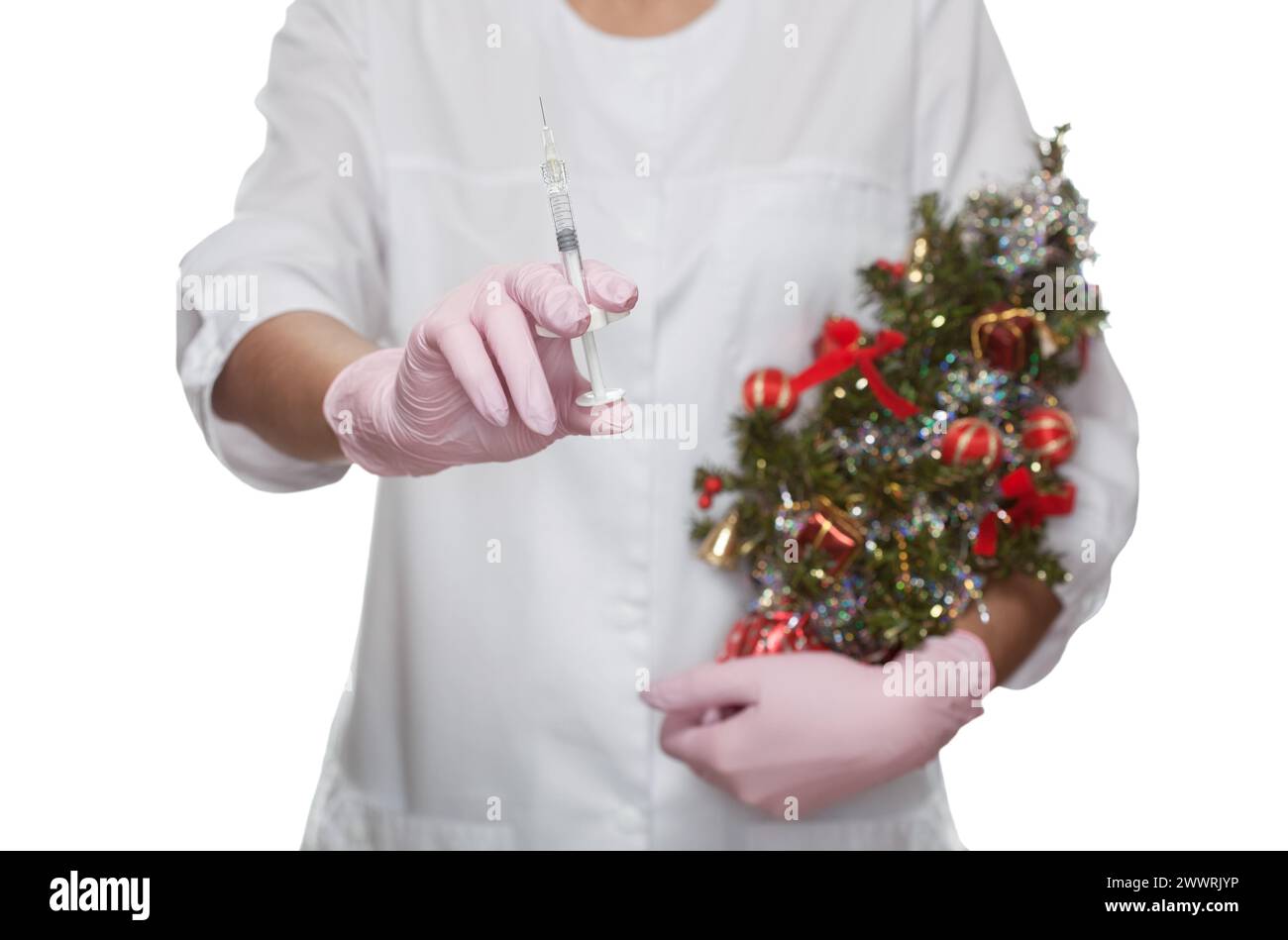 The medical cosmetologist holds a syringe for injection and a small ...