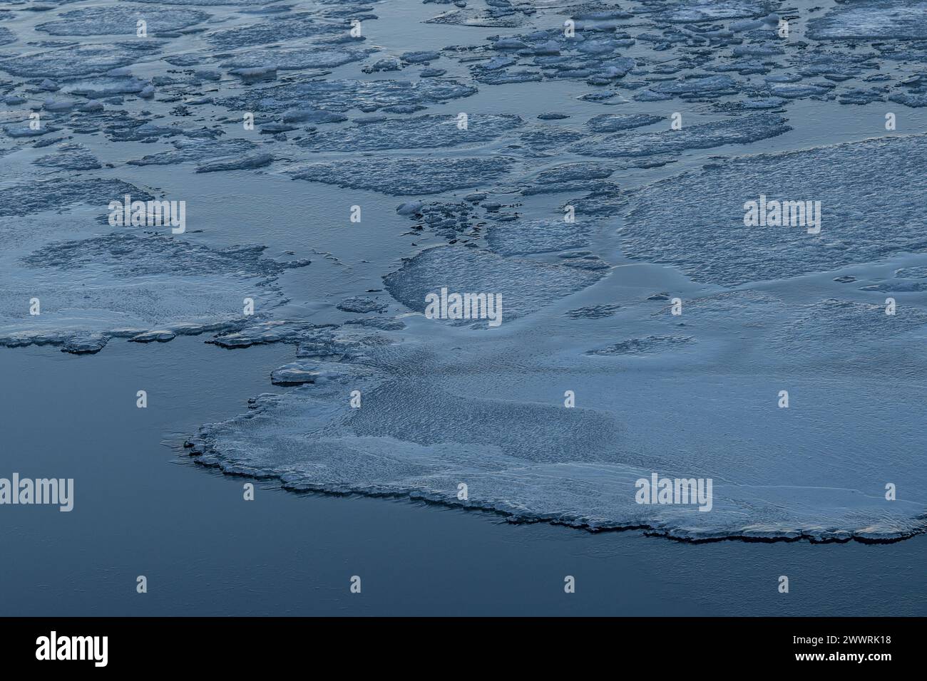 The Frozen ice breaking, revealing a lake Stock Photo - Alamy
