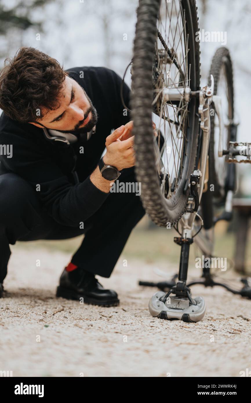 Businessman repairing bicycle tire hi-res stock photography and images ...