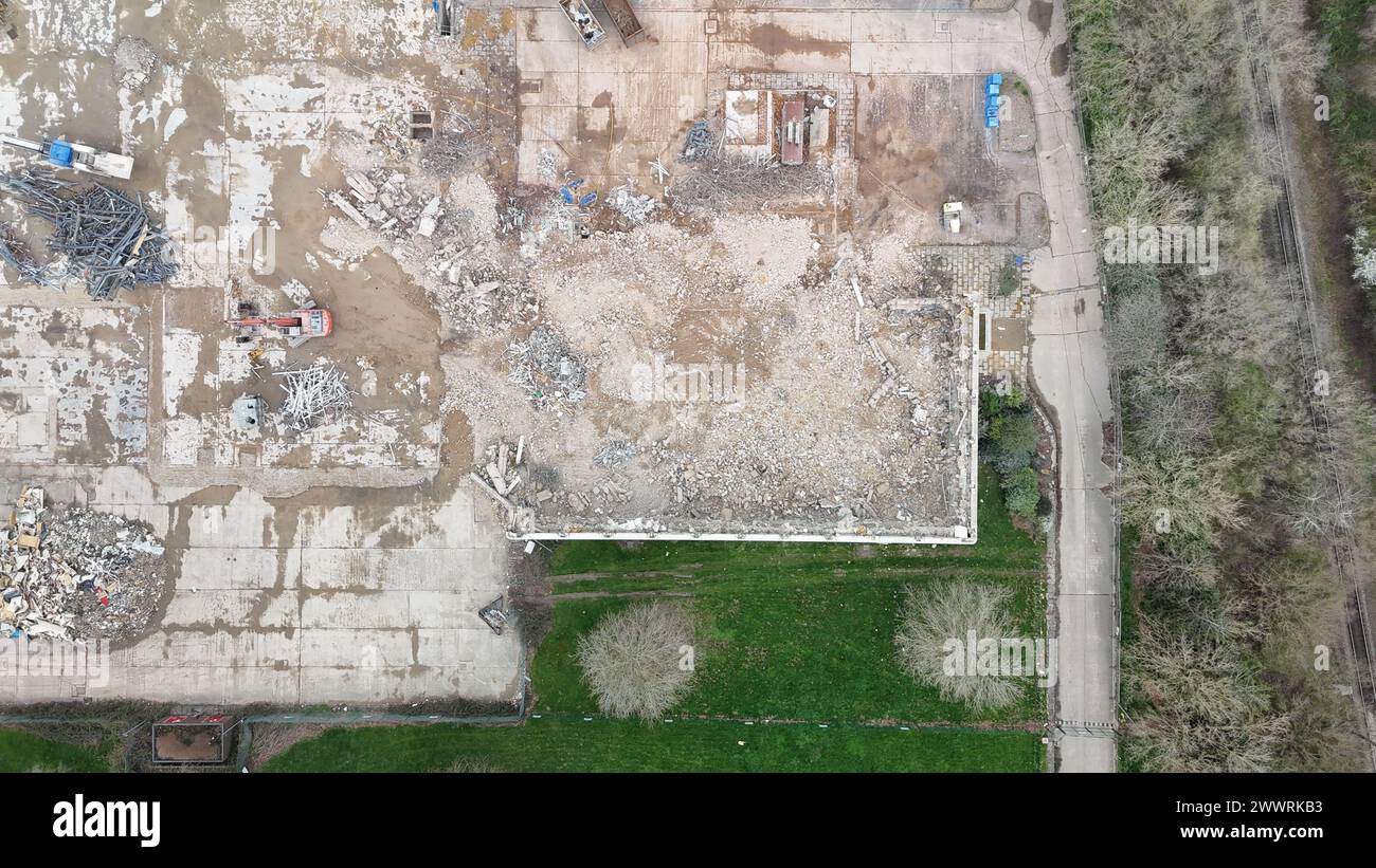 Aerial view of a partially demolished building being leveled to its ...