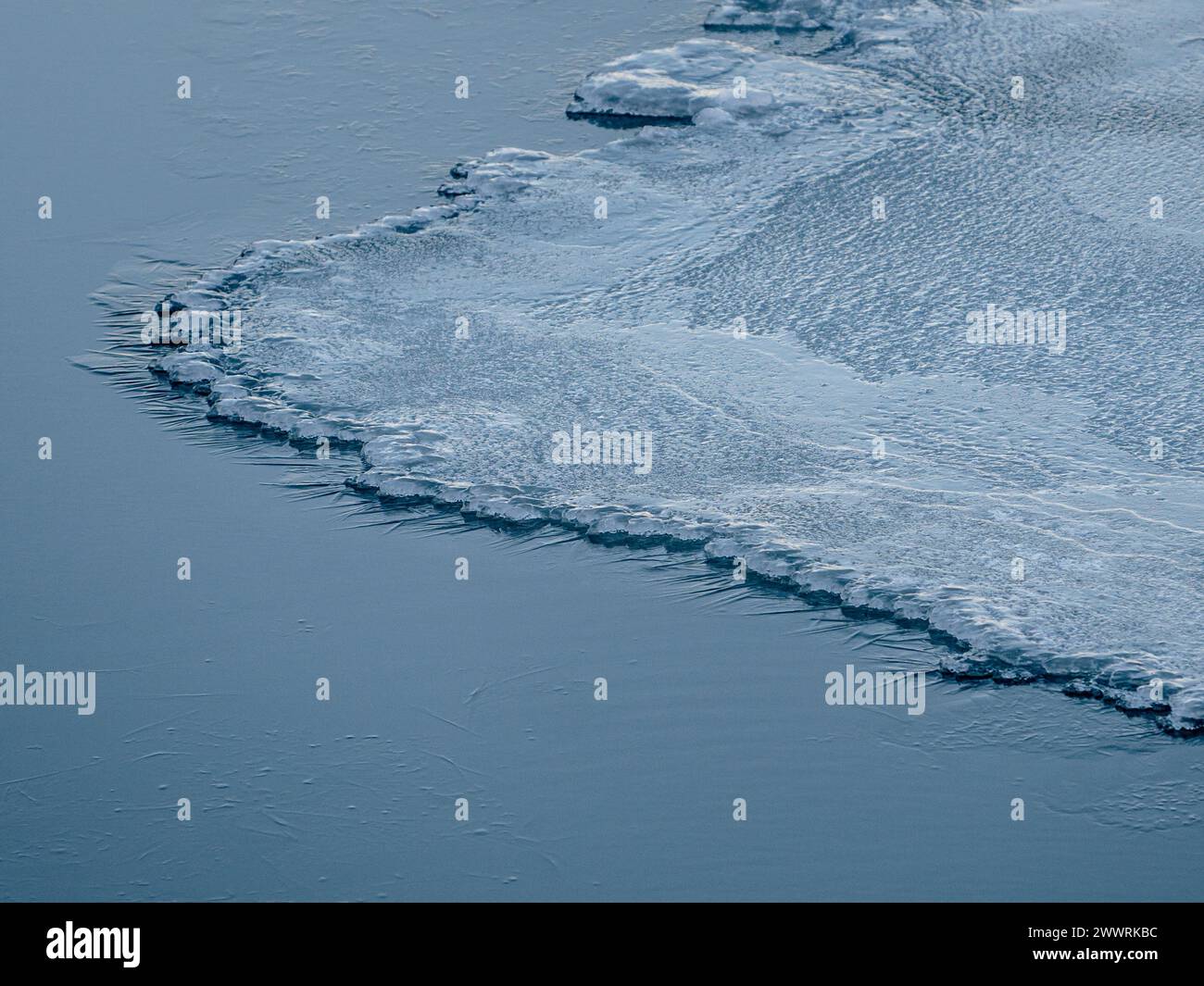 Ice melting in a flowing river Stock Photo - Alamy