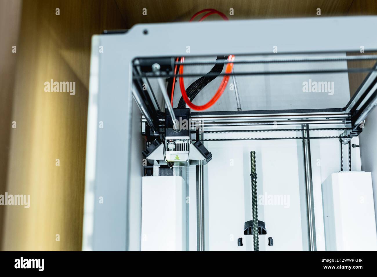 3d printer with bright red filament Stock Photo - Alamy