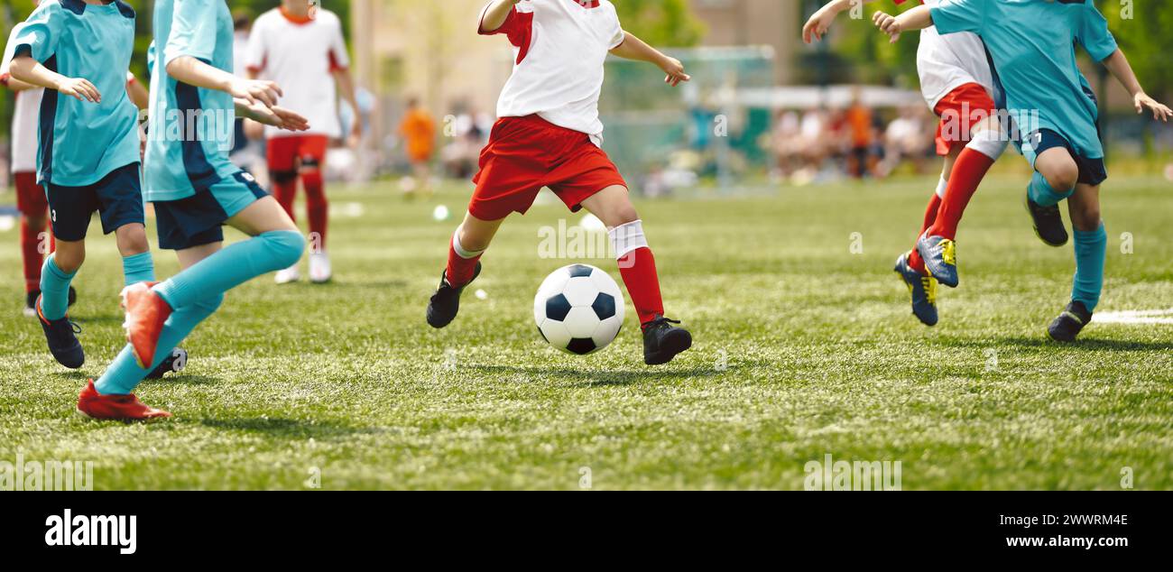 Young Players in Soccer Game. Boy Kicking Soccer Ball Towards Goal ...