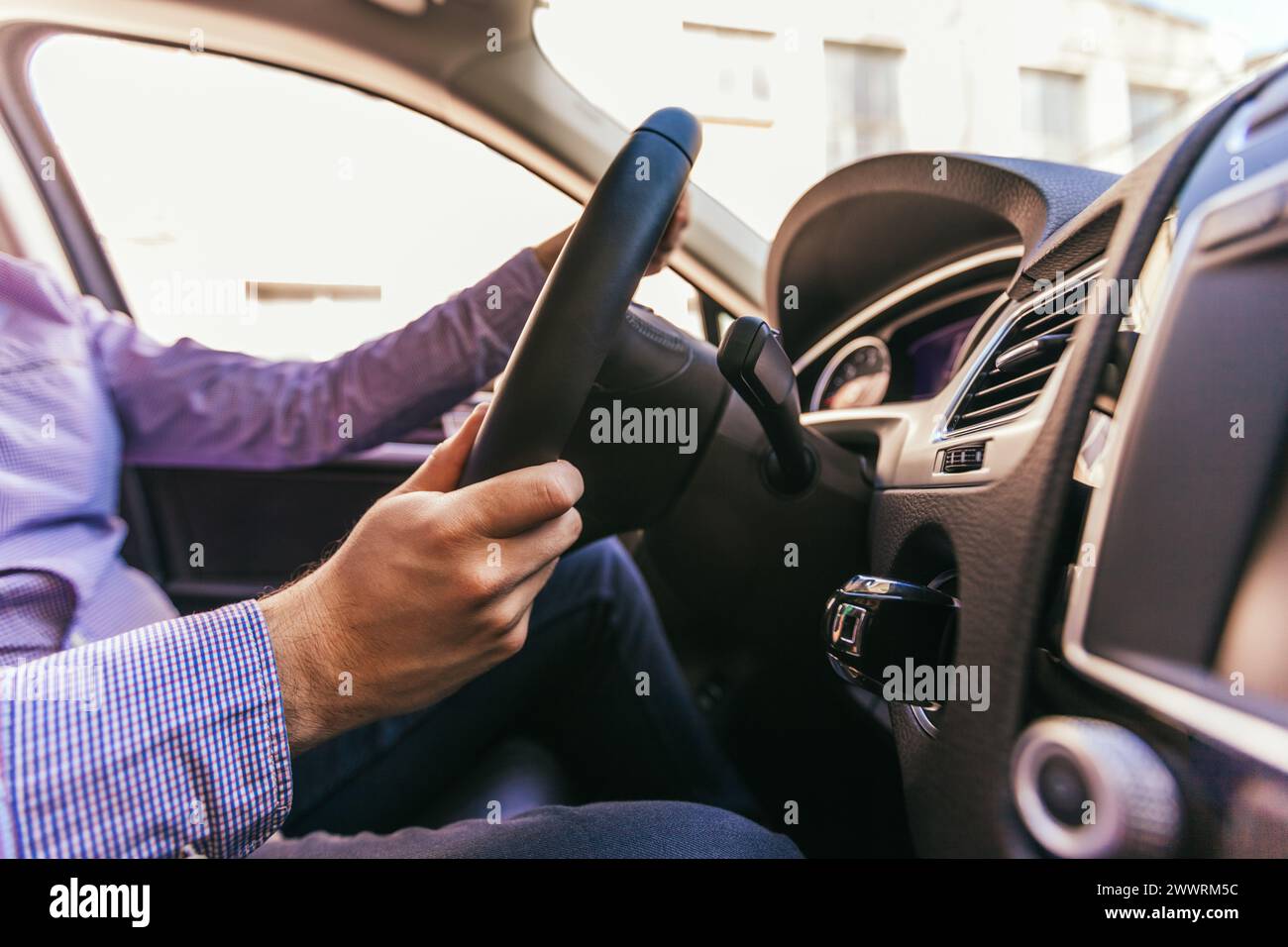 Close-up of a male hand in a modern car Stock Photo - Alamy