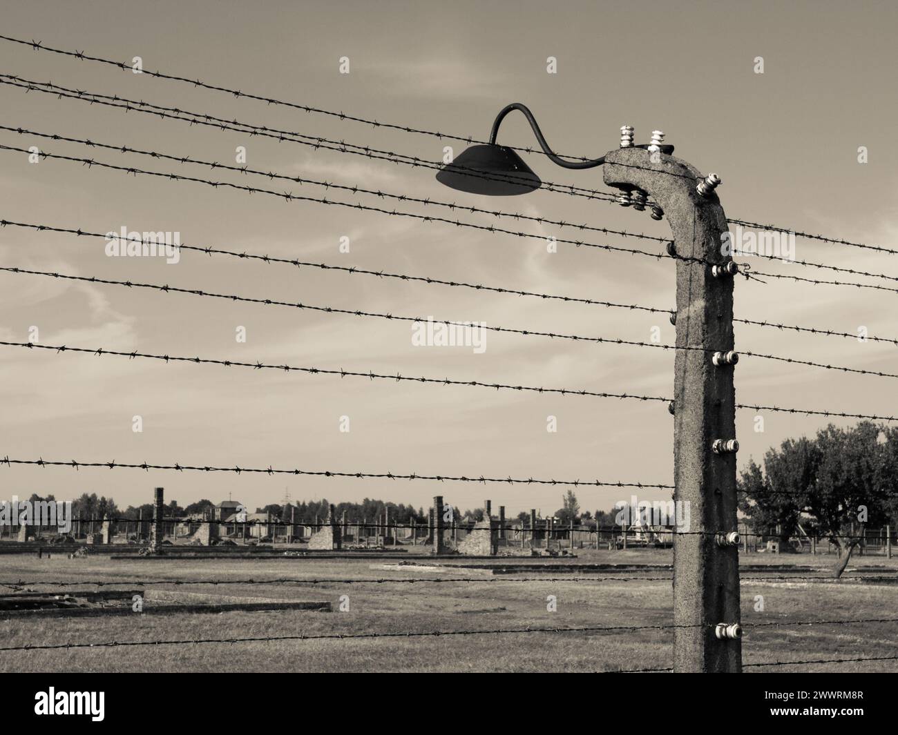 Barb wire fence with lamp in former German Nazi concentration and ...