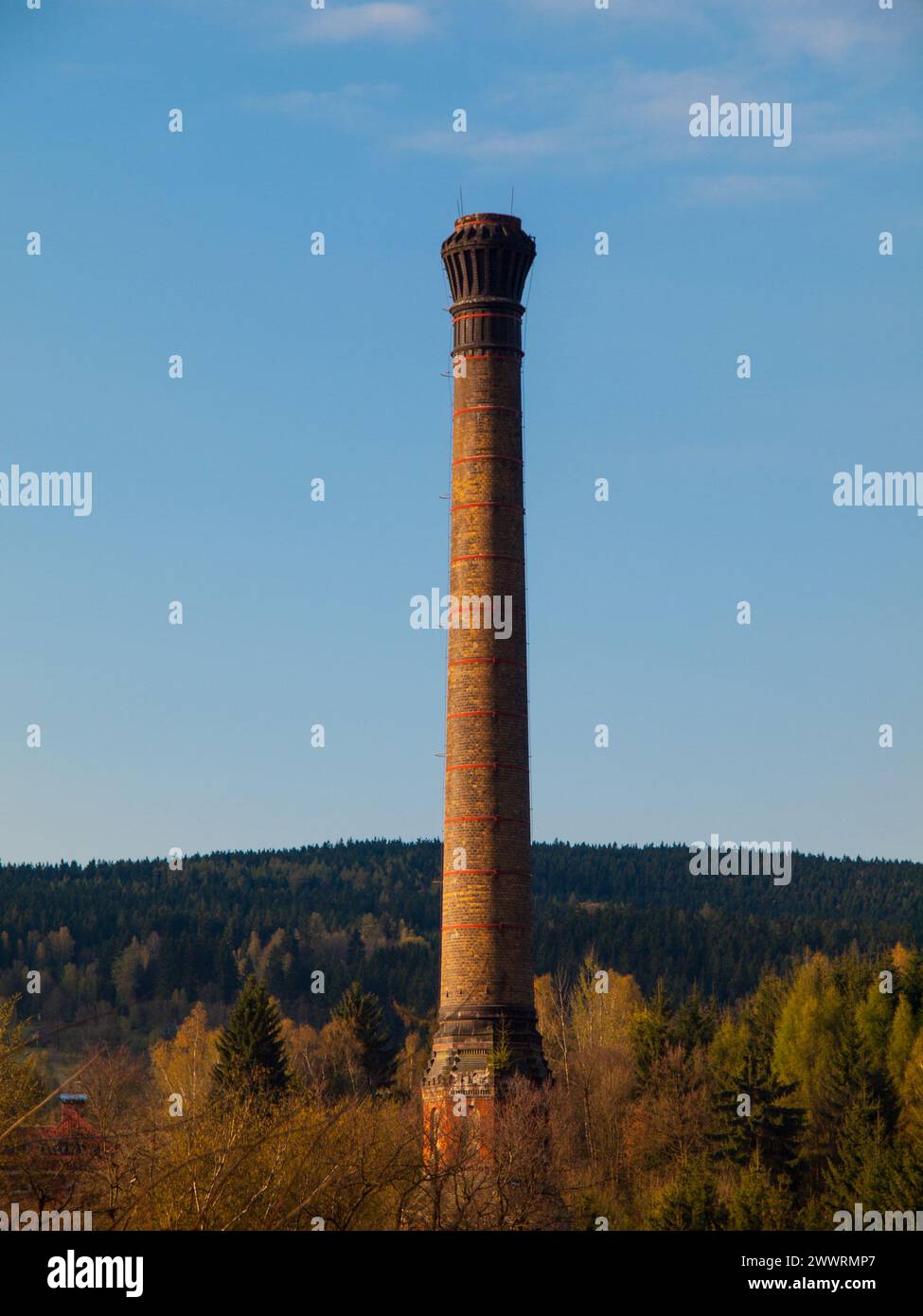 Tall industrial factory chimney located in the nature Stock Photo - Alamy