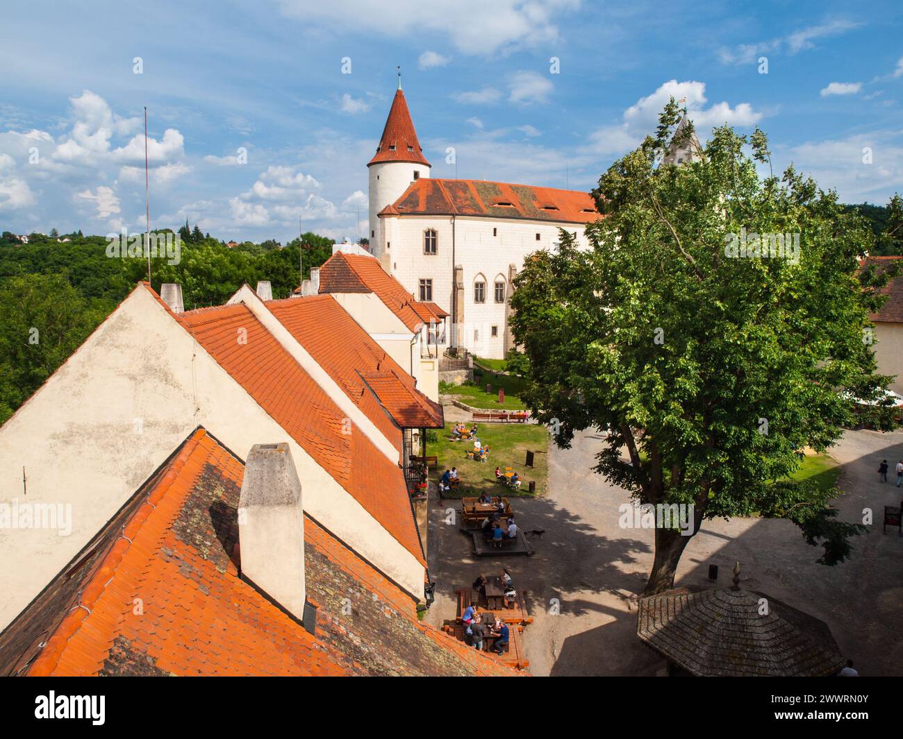 Courtyard, red rooftops and houses with white facade on Krivoklat ...