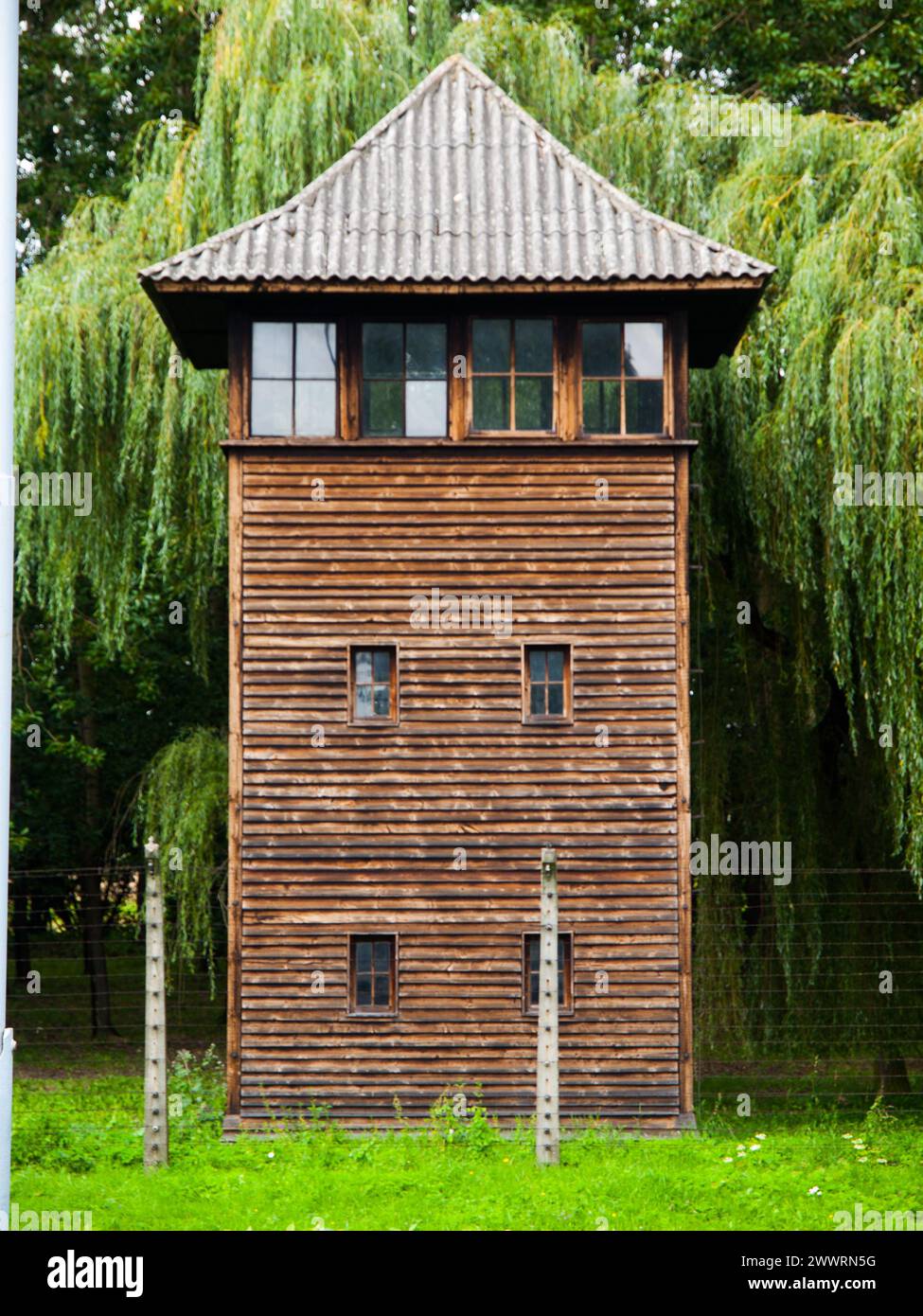 Wooden guard tower behind the fence of prison Stock Photo - Alamy
