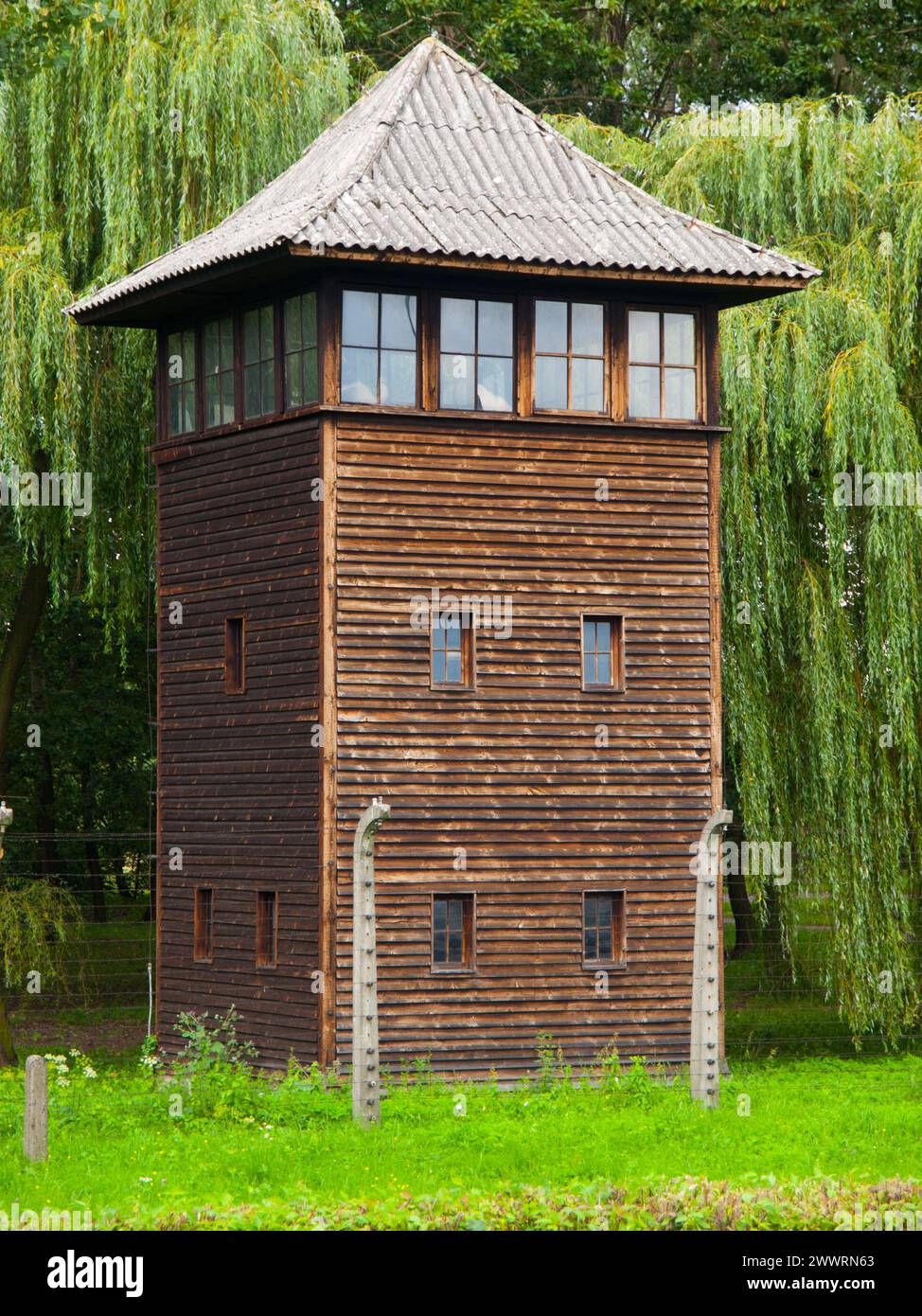 Wooden guard tower behind the fence of prison Stock Photo - Alamy