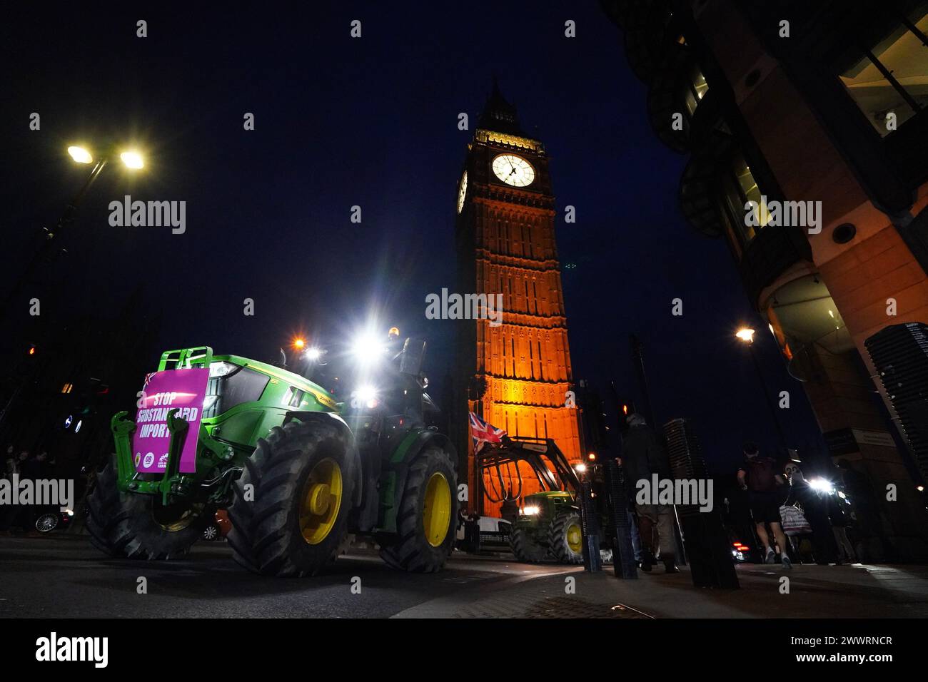 Farmers take part in a tractor "go-slow" through Parliament Square ...