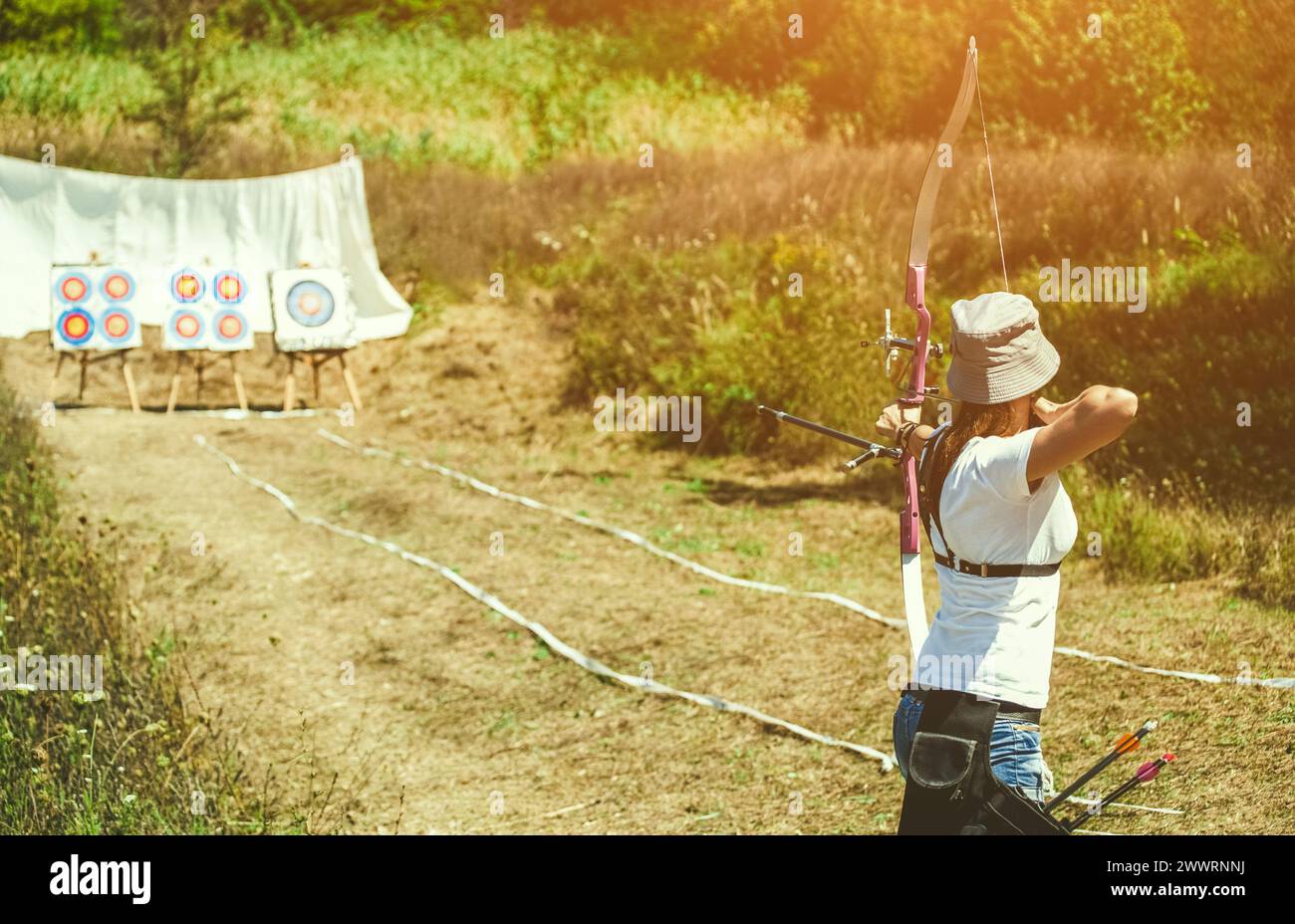 Girl shoots an arrow hi-res stock photography and images - Alamy