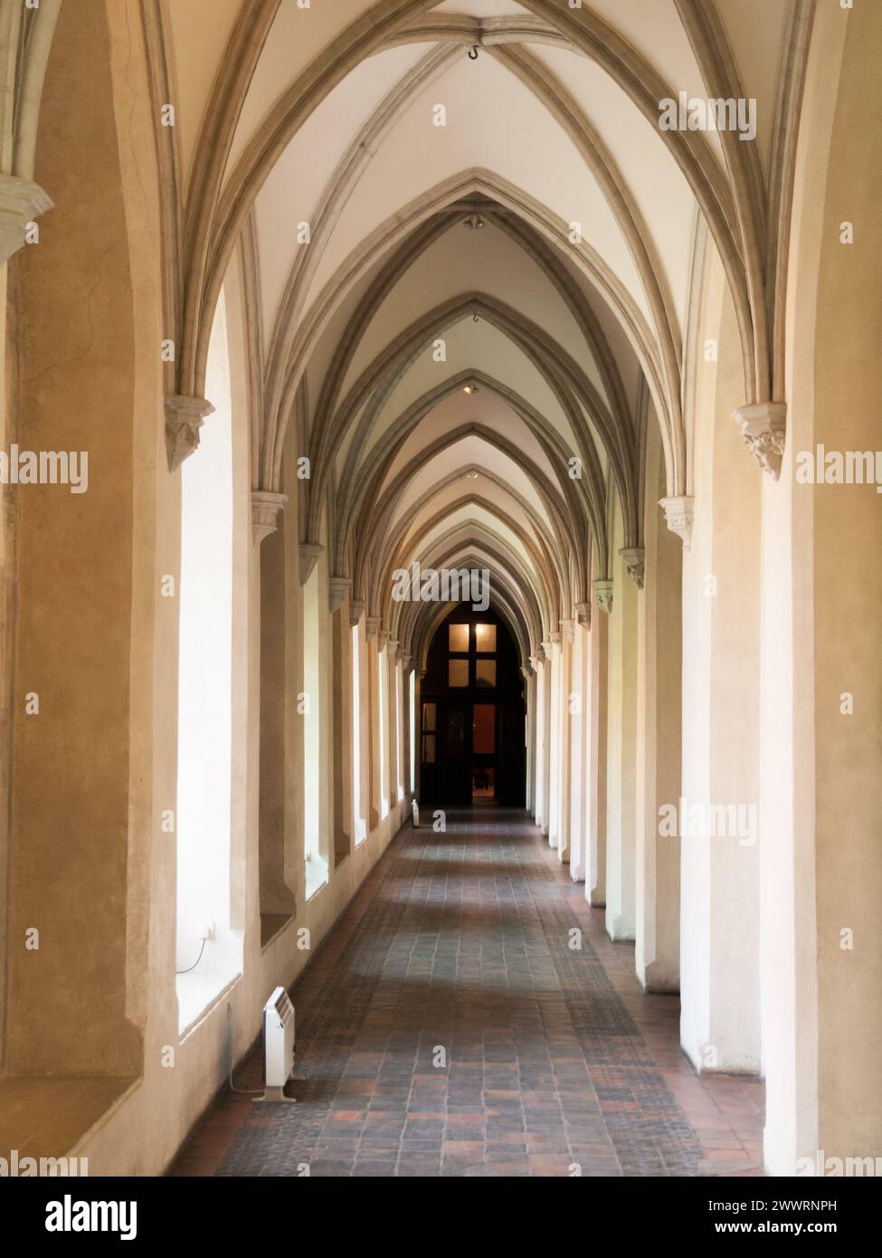 Long arched cloister in the medieval castle Stock Photo - Alamy