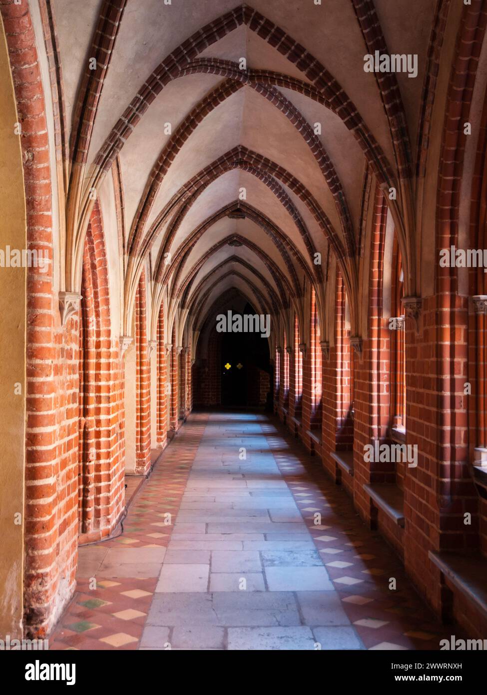 Long arched cloister in the medieval castle Stock Photo - Alamy