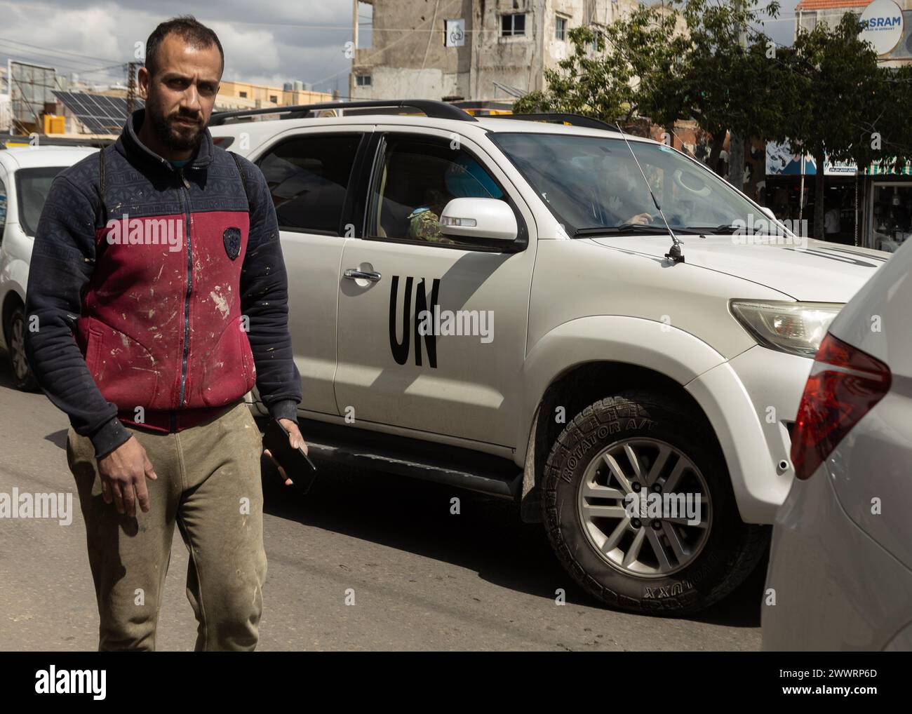 Saida, Lebanon. 22nd Mar, 2024. A man walks past a United Nations ...