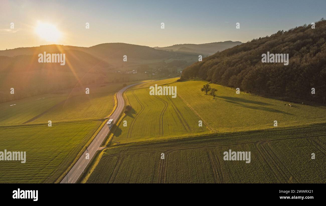 Vehicles on road through green hi-res stock photography and images - Alamy