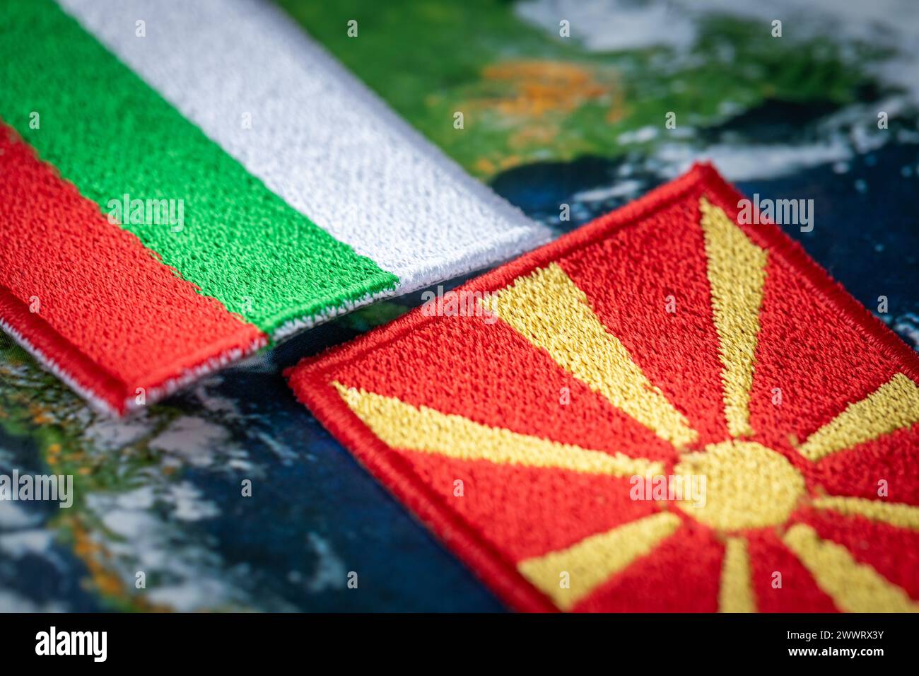 Bulgaria and Macedonia flags patches and country symbols on globe background, Close up, Concept ...