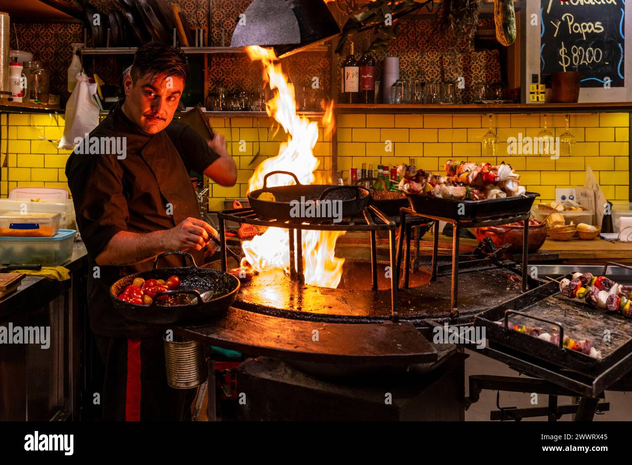 A Chef Cooking Food At A Cafe In The San Telmo Indoor Market (Mercado ...