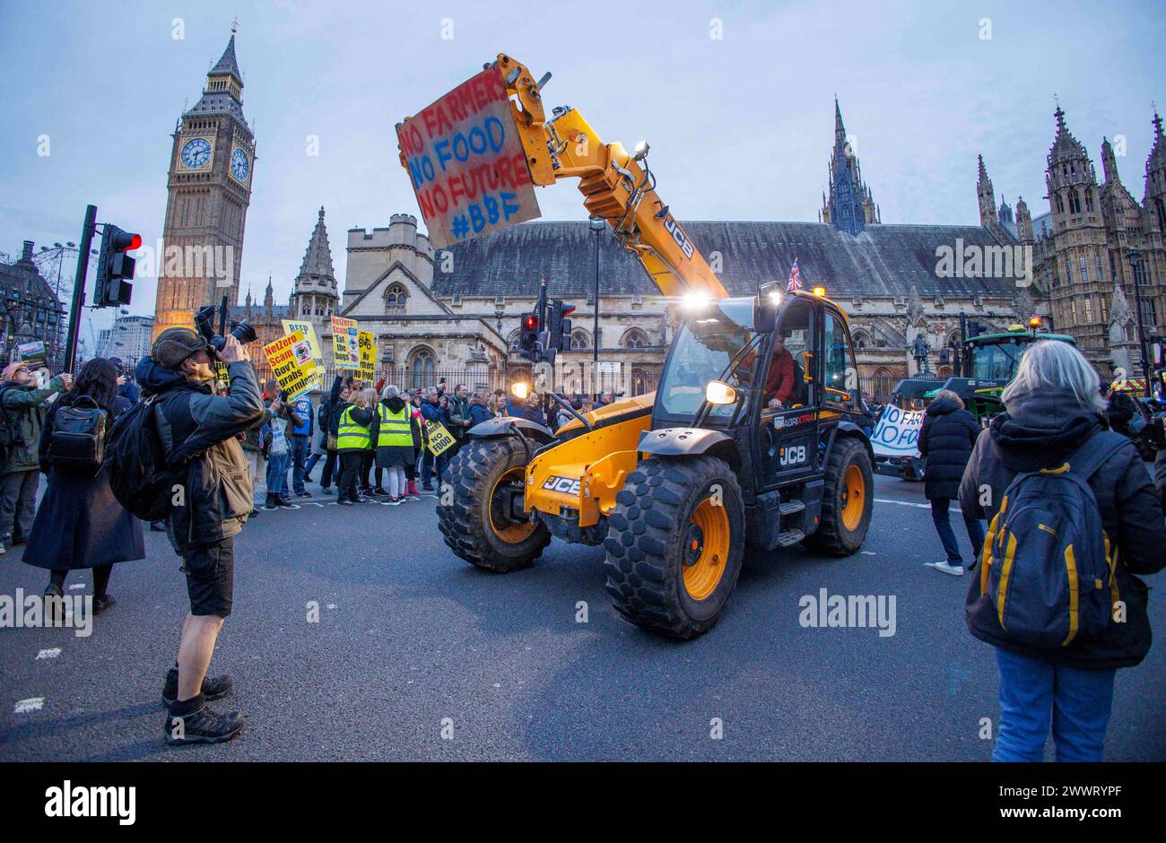 London, UK. 25th Mar, 2024. More than 100 tractors have rolled past the ...