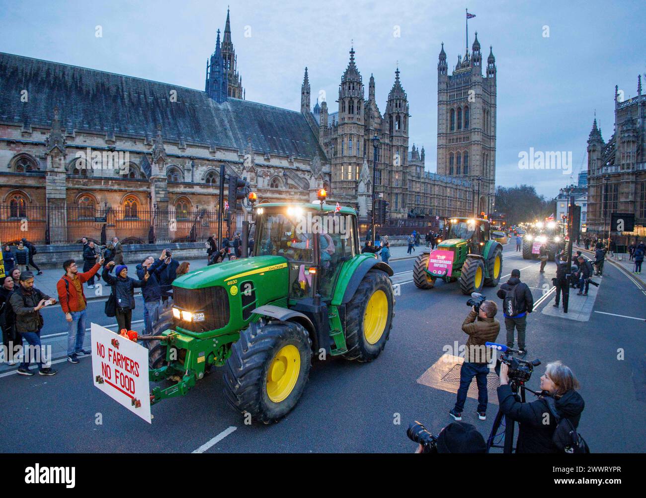 London, UK. 25th Mar, 2024. More than 100 tractors have rolled past the ...