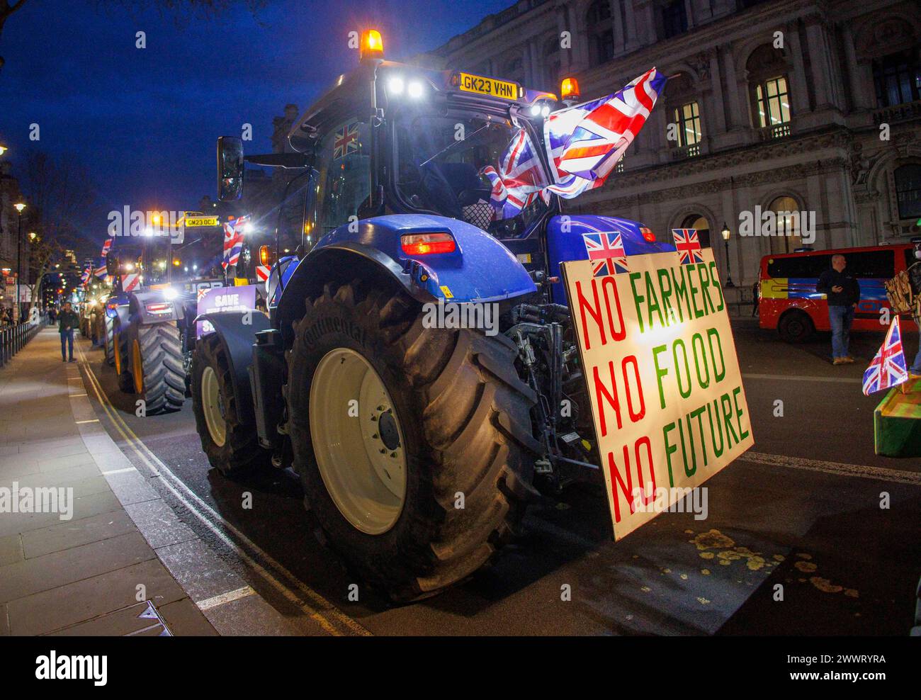 London, UK. 25th Mar, 2024. More than 100 tractors have rolled past the ...