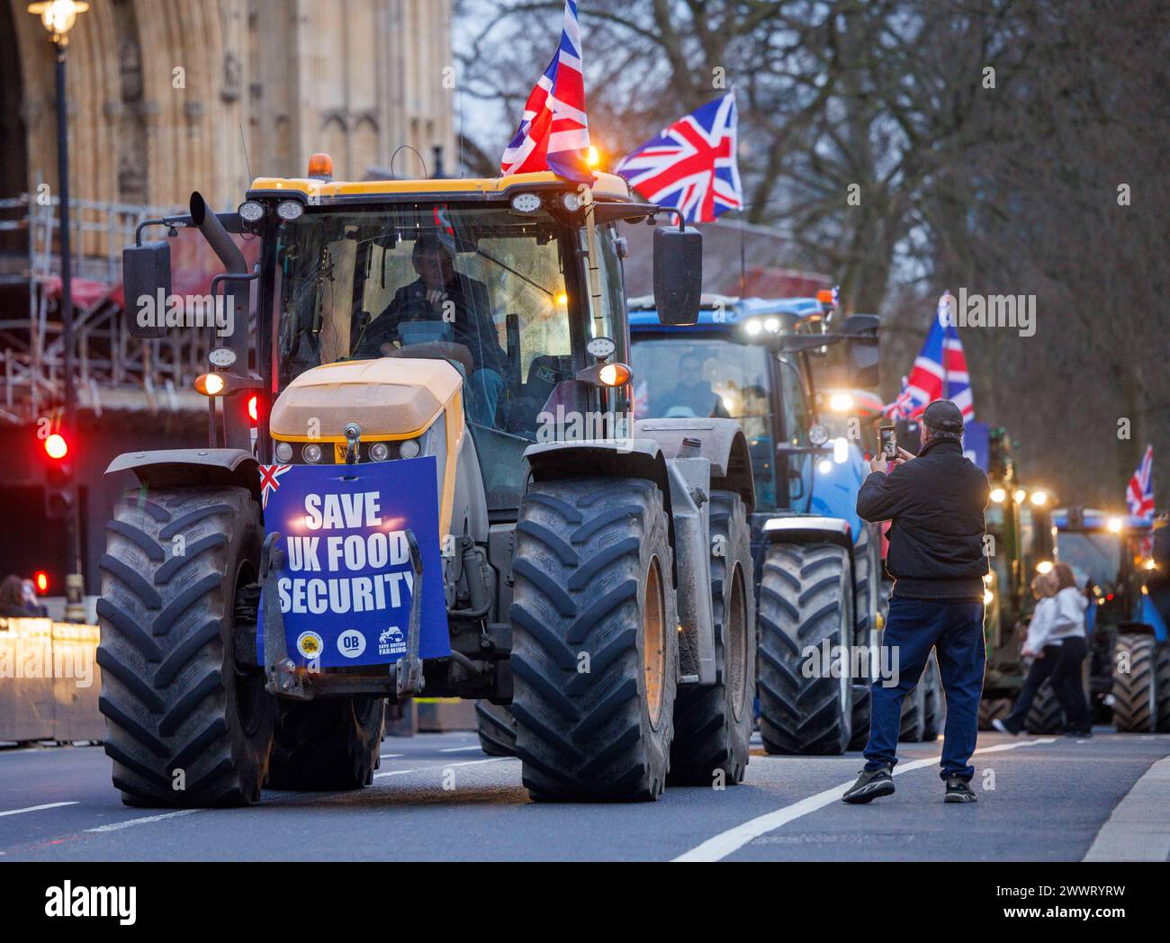 London, UK. 25th Mar, 2024. More than 100 tractors have rolled past the ...