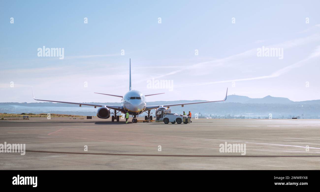 Passenger aircraft jet pushback transporting big plane using Towbarless ...